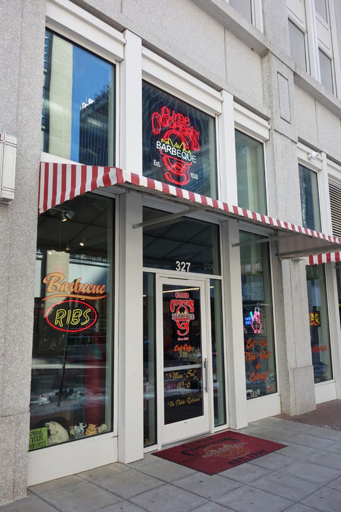 The iconic red awning and pig statue welcome you to Clyde Cooper's, where that neon sign has been promising barbecue bliss since FDR was president.