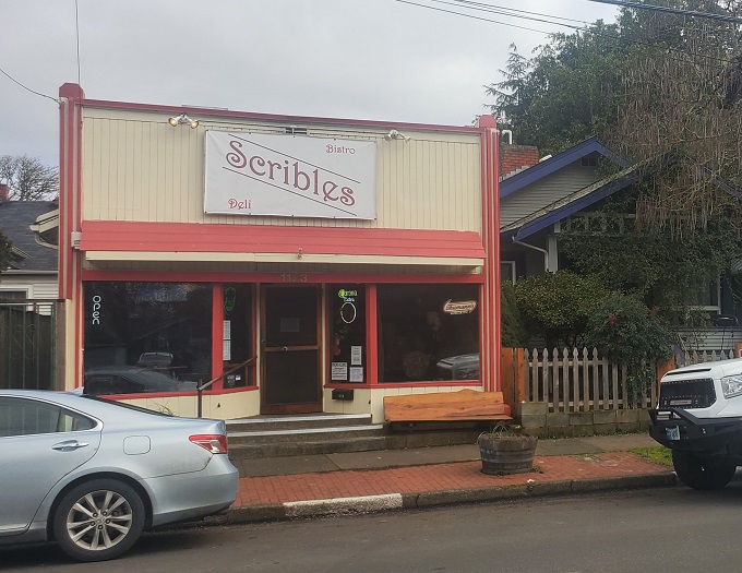 Welcome to sandwich paradise! Scribles Bistro & Deli's charming exterior promises a feast for the senses, with its inviting red trim and vintage-style sign.