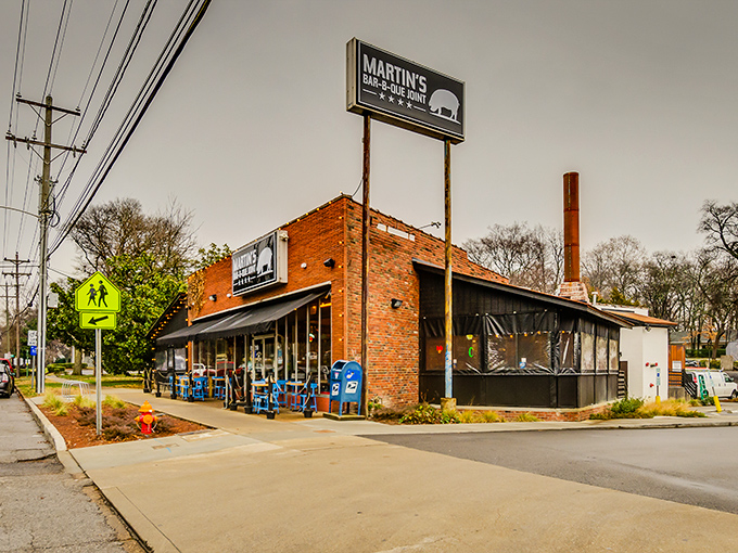The red brick exterior of Martin's Bar-B-Que Joint beckons hungry pilgrims with its no-nonsense fa&ccedil;ade and the promise of smoky delights within.