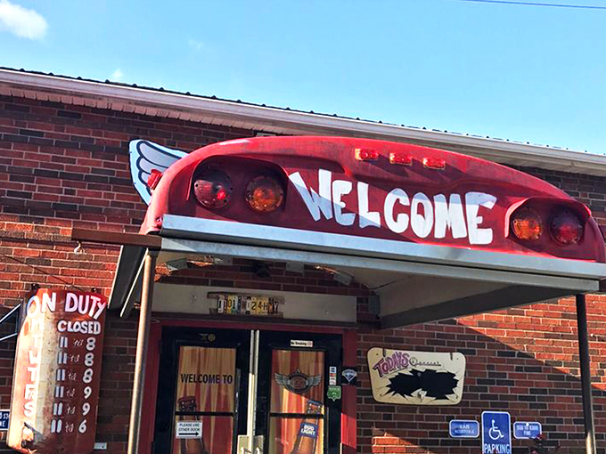 The entrance says it all: repurposed school bus meets flame-adorned brick wall. Barbecue paradise doesn't need fancy signage when the aroma does the talking.