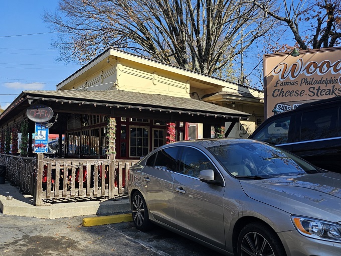 Nestled among flowering trees, Woody's unassuming exterior is like finding a secret Philadelphia embassy on Atlanta soil. Cheesesteak diplomacy at its finest.