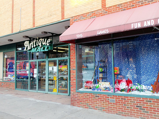 The vintage "Antique Mall" sign beckons like an old friend, promising treasures behind those glass doors on Massachusetts Street.