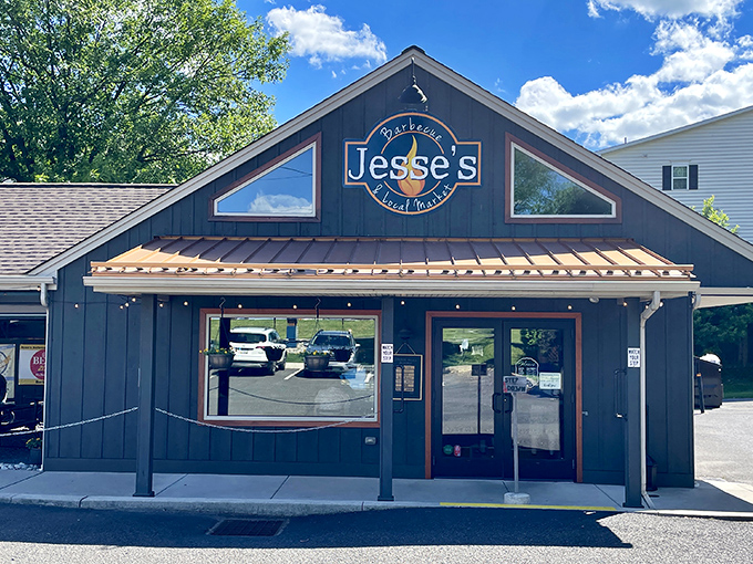 Jesse's welcoming exterior beckons hungry travelers with its rustic charm and copper accents. The promise of barbecue paradise awaits behind those doors.
