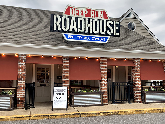 The unassuming exterior of Deep Run Roadhouse proves once again that the best BBQ joints often look like places your GPS would apologize for sending you to.