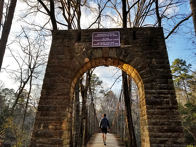 Nature's mirror game at its finest. Tishomingo's lake reflects autumn foliage like a master painter showing off, creating a double dose of Mississippi magic.