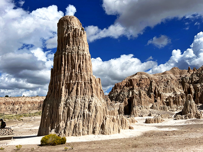 Nature's skyscraper stands proudly against Nevada's impossibly blue sky. This towering spire is what geological patience looks like after a few million years.