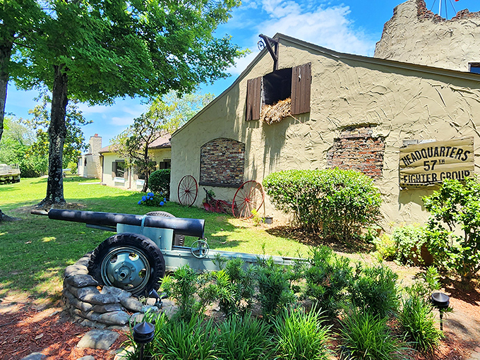 The fortress-like exterior of 57th Fighter Group stands ready for your culinary mission, complete with vintage artillery that's thankfully only targeting your appetite.