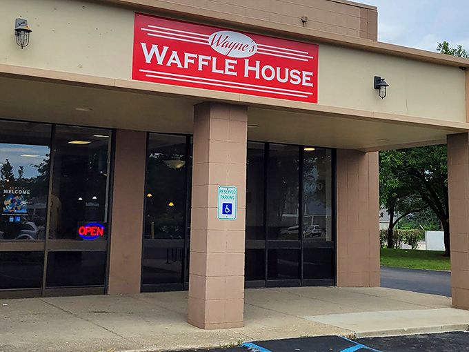 The bright red sign beckons like a lighthouse for the breakfast-starved. Wayne's Waffle House stands ready to fulfill your deepest carb fantasies. 