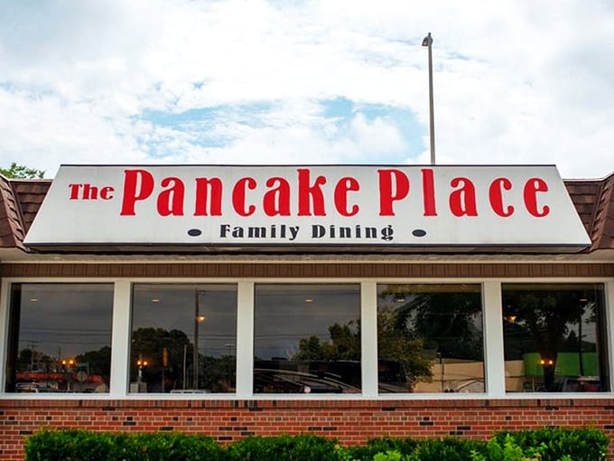 The unassuming exterior of The Pancake Place stands like a breakfast lighthouse, beckoning hungry travelers through Green Bay's morning fog with promises of pancake perfection.