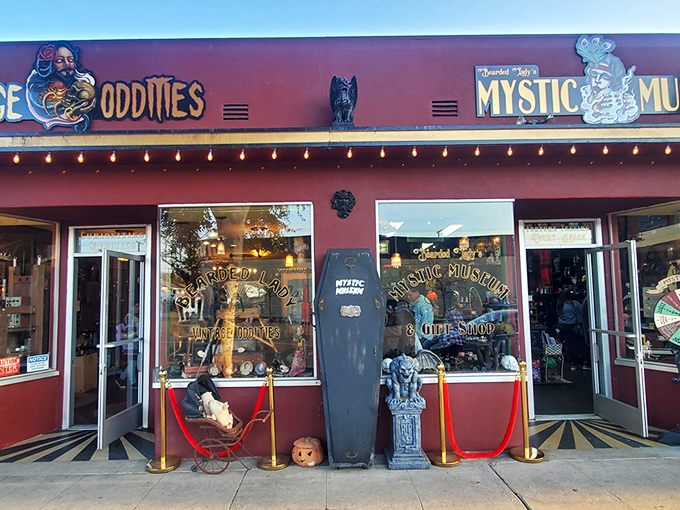 The vintage shop exterior glows with retro charm, beckoning curious souls with its crimson façade and twinkling carnival lights. Adventure awaits!