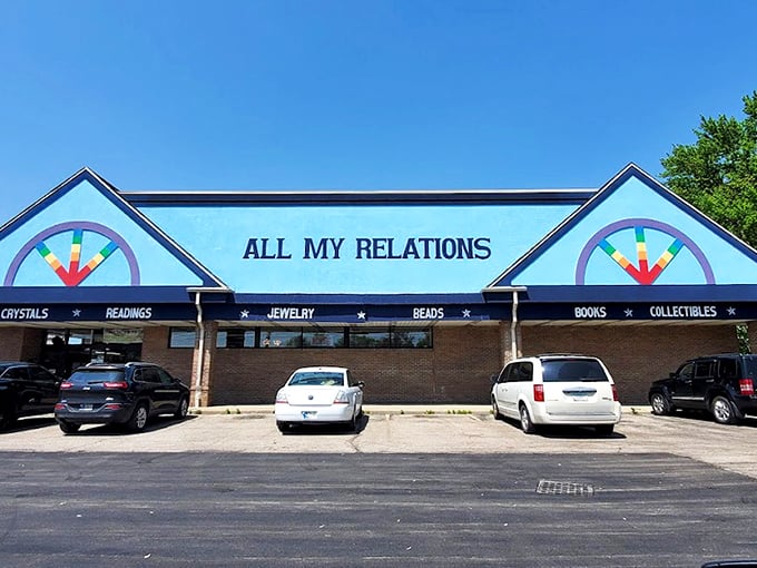 The rainbow-painted facade promises cosmic adventures within, where "CRYSTALS" and "READINGS" boldly announce this isn't your average strip mall tenant. 