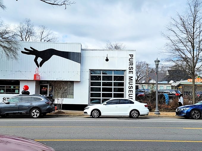 The striking exterior features a giant hand clutching a red purse&mdash;like King Kong if he'd had better fashion sense.