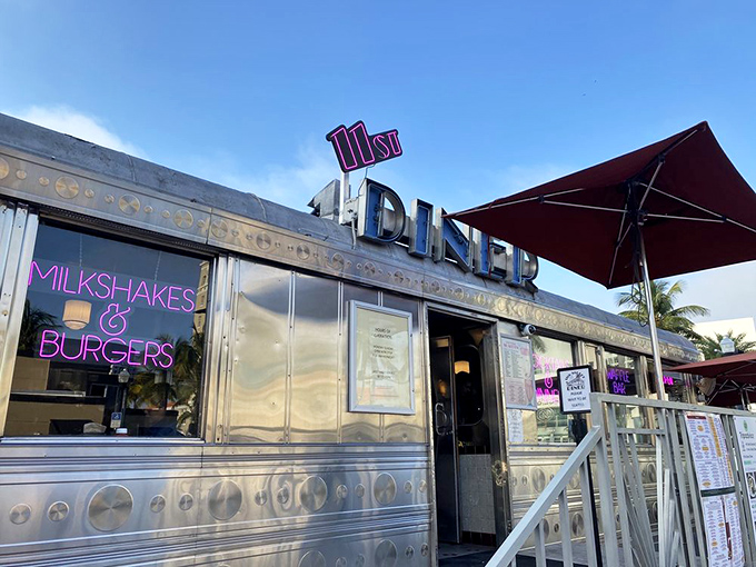 The gleaming stainless steel exterior of 11th Street Diner shines like a time machine in the Miami sun, complete with neon promises of milkshakes that'll make your inner teenager do cartwheels.