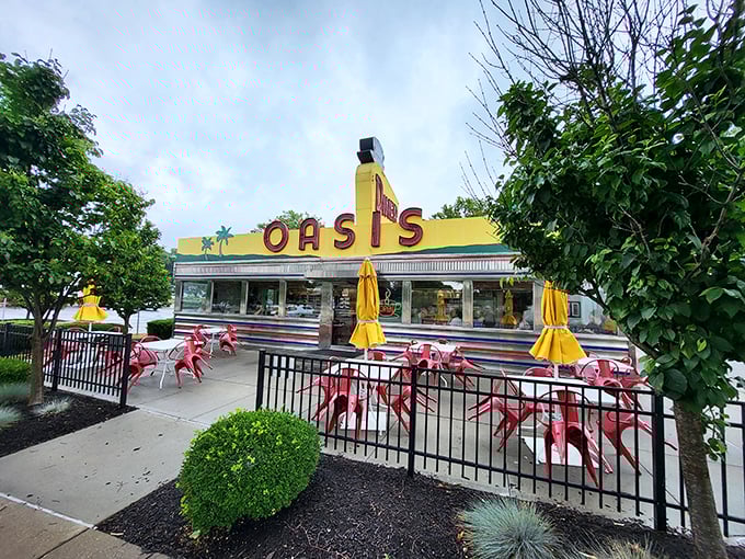 The gleaming yellow exterior of Oasis Diner stands as a sunshine-colored time portal on Plainfield's Main Street, where mid-century dreams are served daily.