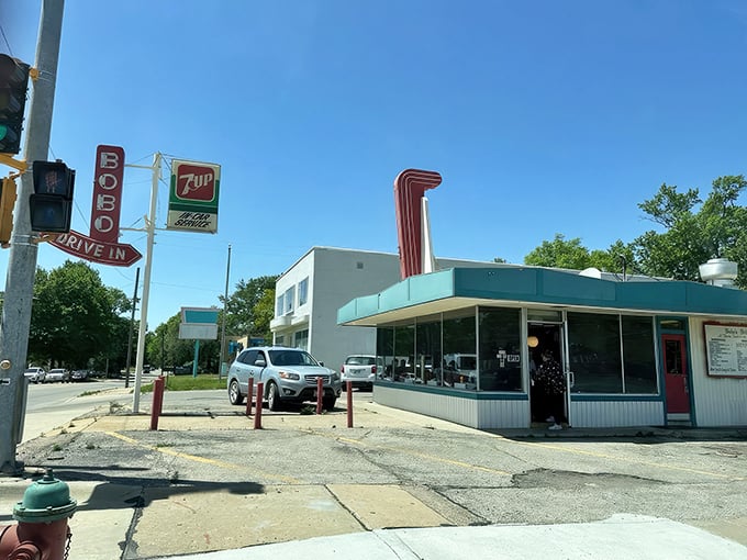 A slice of Americana stands proudly against the Kansas sky, its turquoise trim and cherry-red accents promising delicious nostalgia by the plateful.