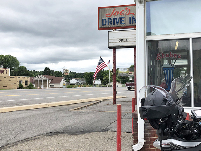 Joe's Drive In stands proudly against the Pennsylvania sky, its classic red and white exterior beckoning hungry travelers like a beacon of comfort food hope