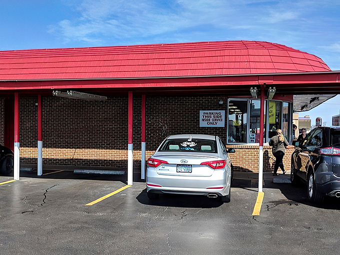 The iconic red-roofed Doumar's stands like a time capsule on the Norfolk corner, its curved architecture a beacon for hungry travelers seeking authentic Americana.