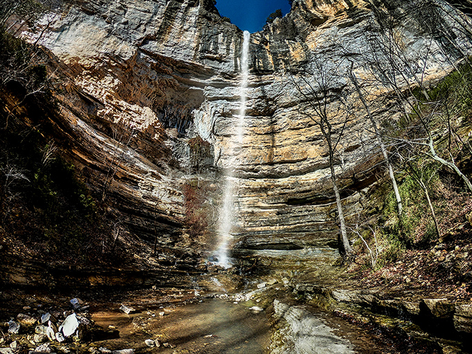 Nature's skyscraper in reverse &ndash; Hemmed-In Hollow's 209-foot cascade plummets down layered limestone cliffs, creating a spectacle worth every step of the journey.