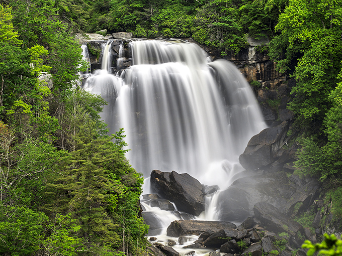 Nature's masterpiece on full display&mdash;Whitewater Falls cascades 811 feet through lush Appalachian forest, creating a scene worthy of the most ambitious landscape painting. 
