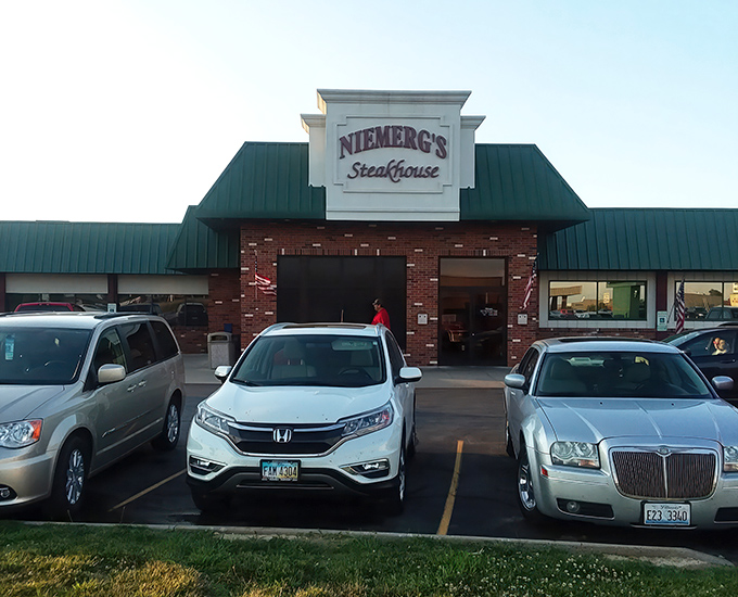 The classic brick-and-green exterior of Niemerg's stands like a culinary lighthouse for hungry travelers. Interstate driving never had such a delicious destination waiting at the end.