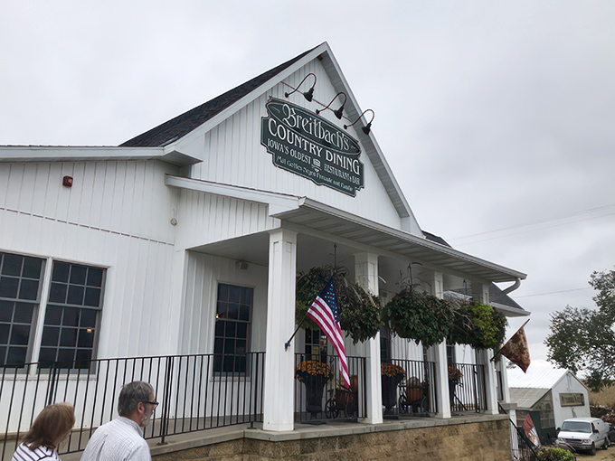The white clapboard facade of Breitbach's stands like a beacon of comfort food, hanging flower baskets swaying in the Iowa breeze.