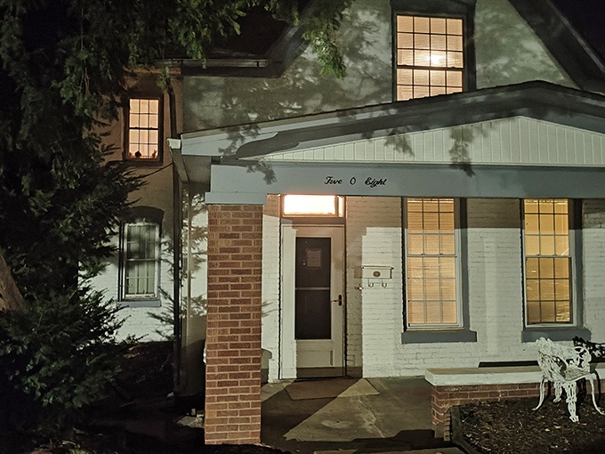 The unassuming facade of the Sallie House belies its reputation as one of America's most haunted locations. Those white walls have stories to tell.