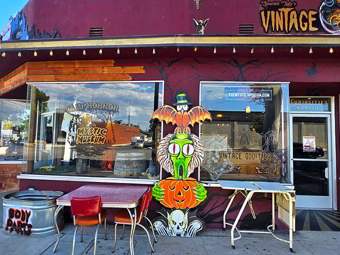 The vintage shop exterior glows with retro charm, beckoning curious souls with its crimson fa&ccedil;ade and twinkling carnival lights. Adventure awaits! 