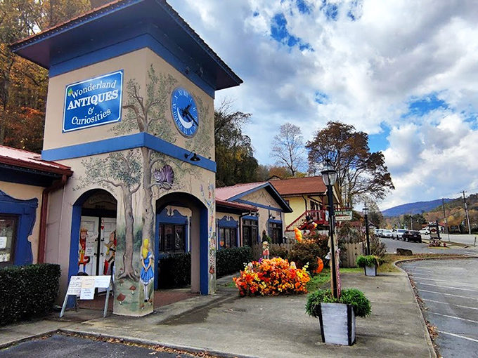 The blue clock tower of Wonderland Antiques stands like a storybook portal in Helen, complete with Alice-themed murals inviting curious souls to tumble down the rabbit hole.