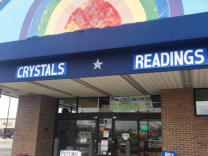 The rainbow-painted facade promises cosmic adventures within, where "CRYSTALS" and "READINGS" boldly announce this isn't your average strip mall tenant.