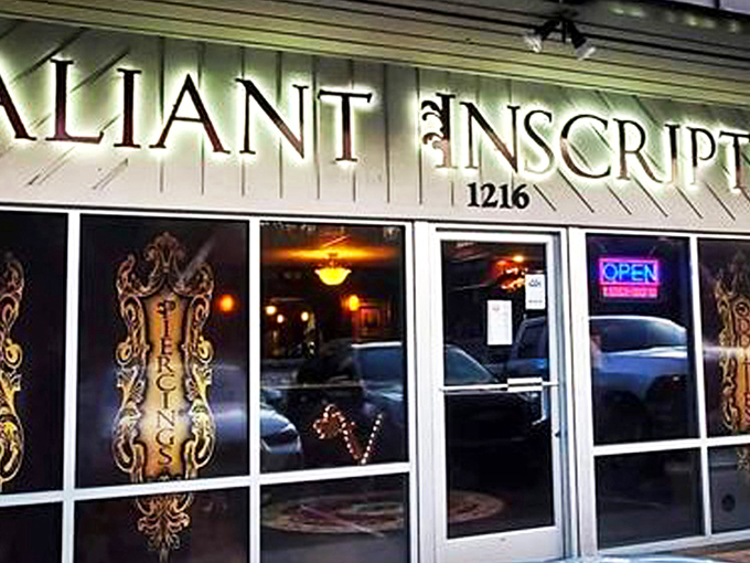 The understated storefront of Valiant Inscript houses Dark and Deviant Oddities, where Asheville's most fascinating collection beckons curious minds from behind elegant gold lettering.