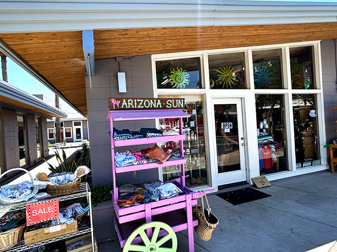 The unassuming storefront of Kactus Jock beckons with colorful displays that spill onto the sidewalk, promising treasures within that celebrate all things Arizona. 