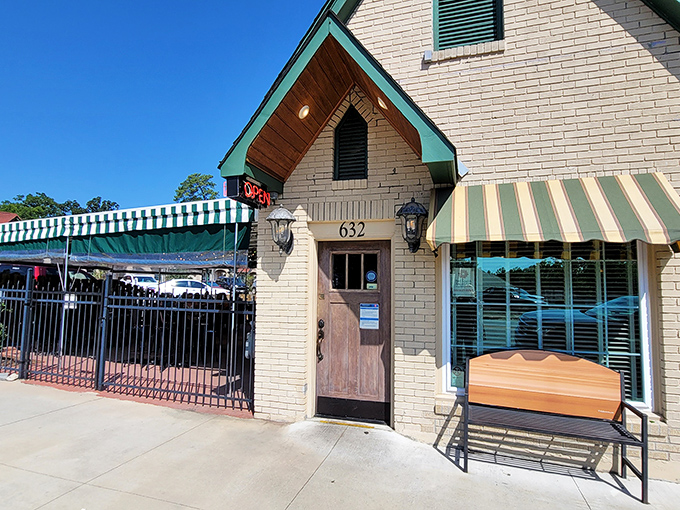 The charming cream brick exterior of Best Cafe & Bar feels like a time capsule of Hot Springs history, complete with those classic green awnings.