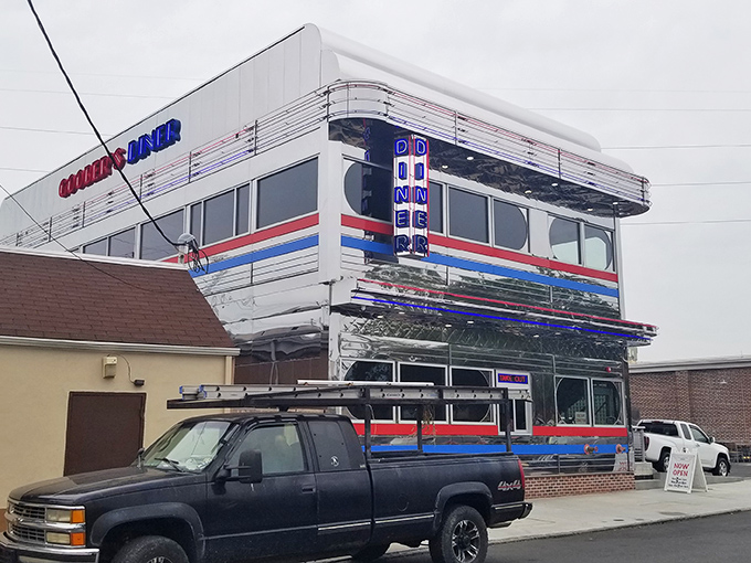 The gleaming chrome exterior of Goobers Diner shines like a beacon of breakfast hope, a retro time machine promising delicious nostalgia inside. 