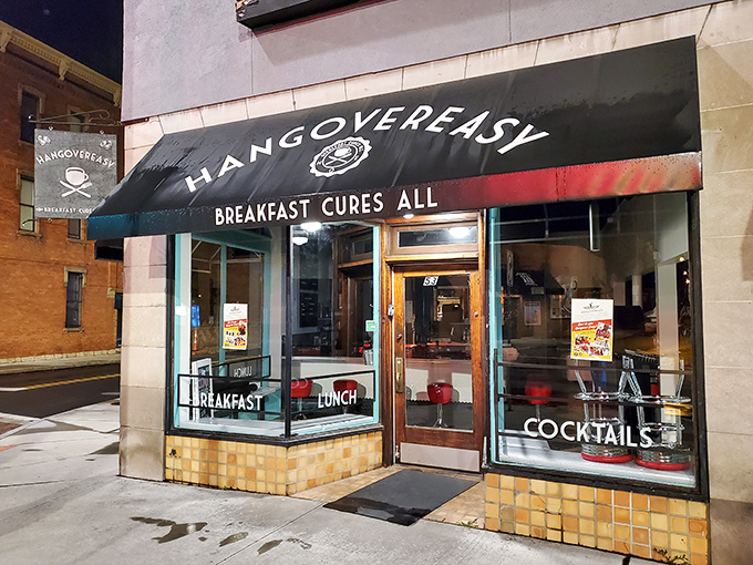 The iconic black awning promises salvation with three simple words: "BREAKFAST CURES ALL." Never has a restaurant sign spoken such profound truth.