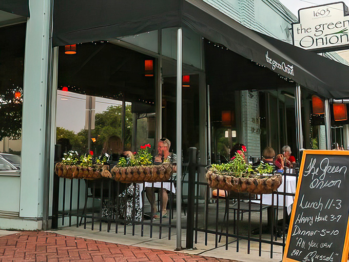 The Green Onion's charming exterior welcomes you with its understated elegance and inviting patio. Like a good first date, it makes a promising impression without trying too hard.