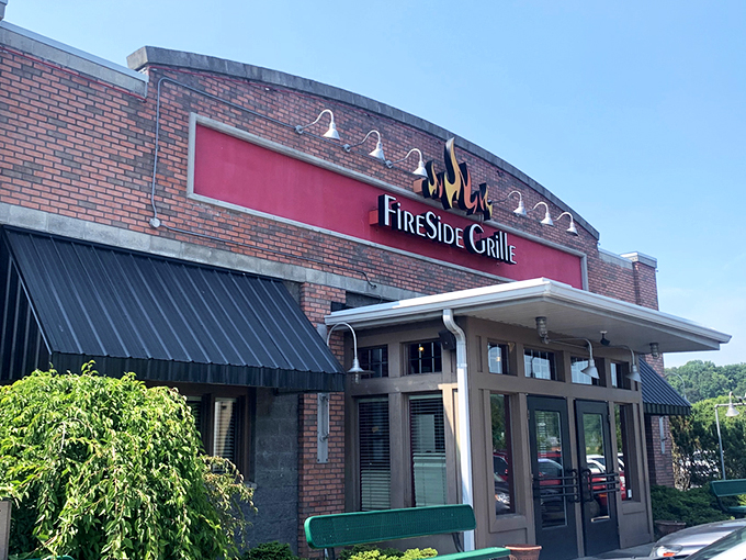 The fiery red glow of FireSide Grille's sign cuts through the night like a beacon for hungry souls wandering Hurricane's streets.