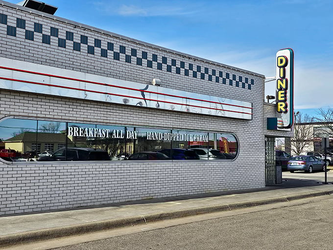 That classic white brick exterior with the checkerboard trim isn't just architecture&mdash;it's a promise of comfort food paradise waiting inside.