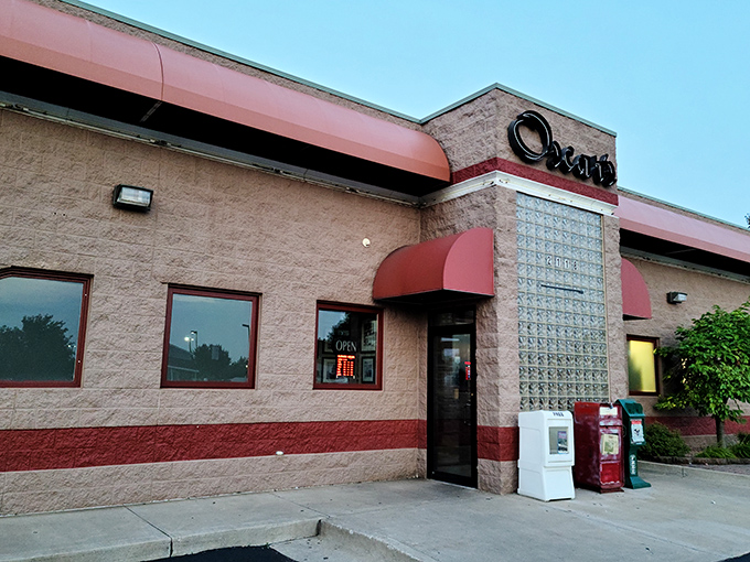 Oscar's welcoming exterior promises comfort food paradise with its distinctive red awnings and classic brick façade—like a time machine to simpler, delicious days.