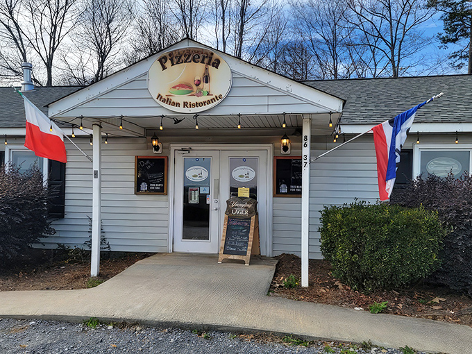 The unassuming exterior of Rizzo's might fool you, but those string lights are practically whispering, "Come inside for the good stuff."