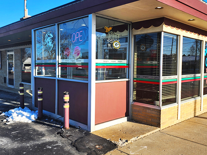 The classic red and green striped awning of Luigi's Pizza Kitchen stands as Kenosha's beacon for carb enthusiasts seeking Italian-American nirvana.