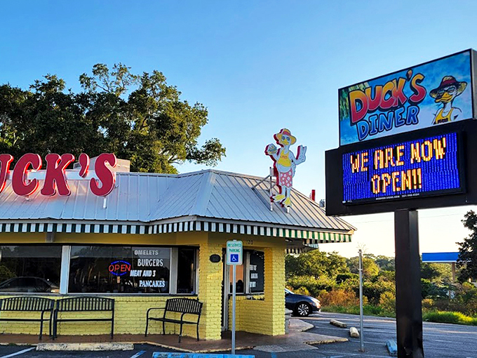 The bright red "DUCK'S" sign stands out like a breakfast lighthouse, guiding hungry souls to this Gulf Shores sanctuary of morning delights.
