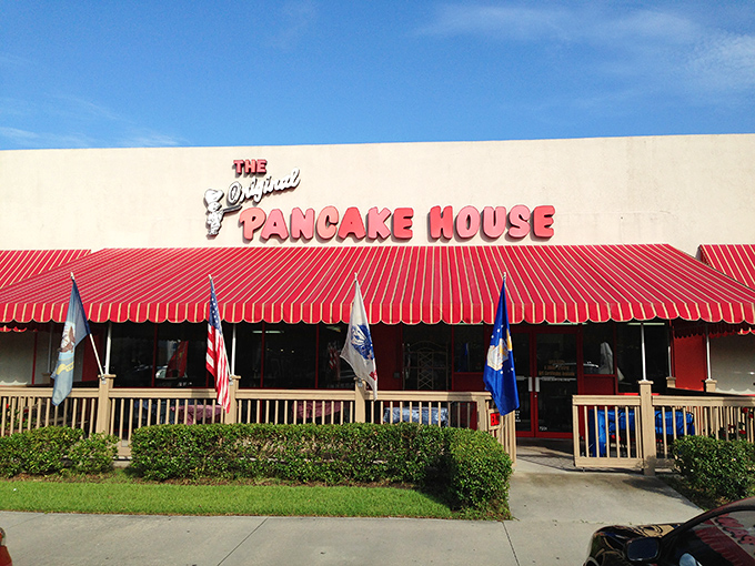 The iconic red awning beckons breakfast enthusiasts like a pancake lighthouse on the shores of morning hunger. A sight for sore, sleepy eyes!