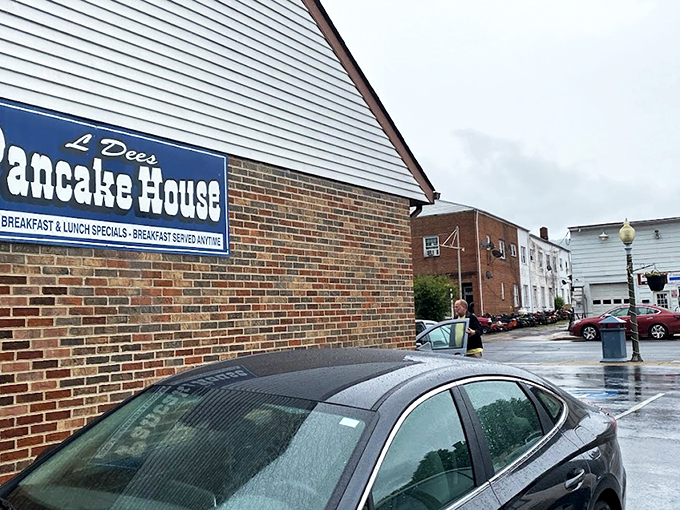 The unassuming brick exterior of L'Dees Pancake House &ndash; where breakfast dreams come true without any architectural showboating. Simple sign, serious pancakes.