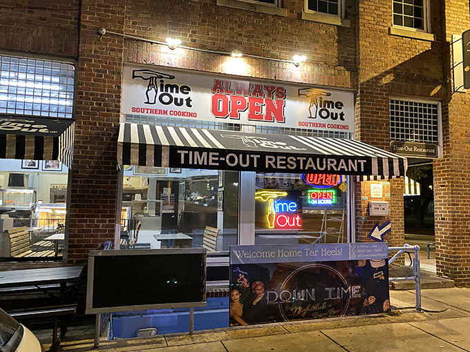 The brick facade of Time-Out beckons hungry visitors with its iconic striped awning and neon signs&mdash;a 24/7 beacon of Southern comfort on Franklin Street.