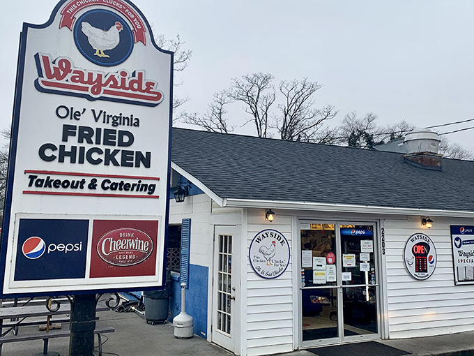 The unassuming white building with its iconic sign promises "Ole' Virginia Fried Chicken" &ndash; a beacon of hope for hungry travelers seeking authentic Southern comfort. 