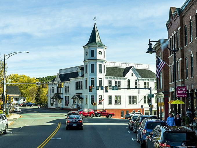 Littleton's iconic white building with its distinctive clock tower stands like a sentinel over Main Street, where Norman Rockwell scenes come to life daily.