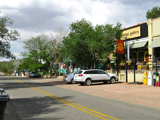 Madrid's main street welcomes you with colorful storefronts and that unmistakable small-town charm. Like stepping into a Wes Anderson film set in the high desert.
