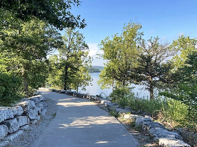 Nature's perfect balance of accessibility and beauty. A paved pathway curves gently alongside the crystalline waters of Table Rock Lake, inviting explorers of all abilities.