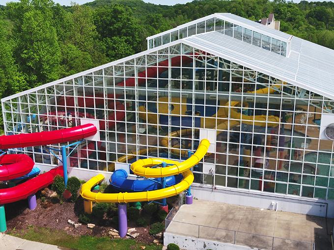 The indoor tropical paradise where winter goes to die. Colorful water structures and artificial palm trees create a mirage of summer under a cathedral of glass.