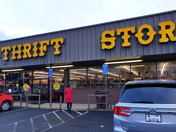 The bold yellow lettering of "THRIFT STORE CENTER" beckons like a siren song to bargain hunters. No fancy frills, just the promise of treasures waiting inside.